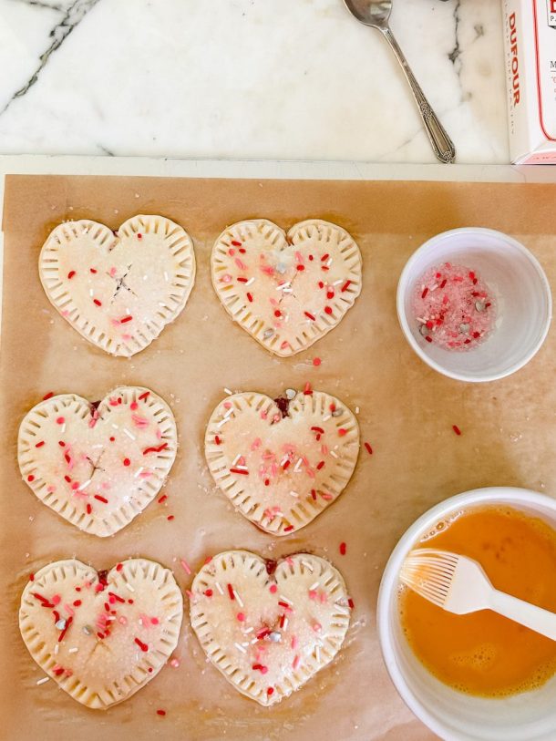 Heart Shaped Raspberry Hand Pies For Valentines Day - Modern Glam