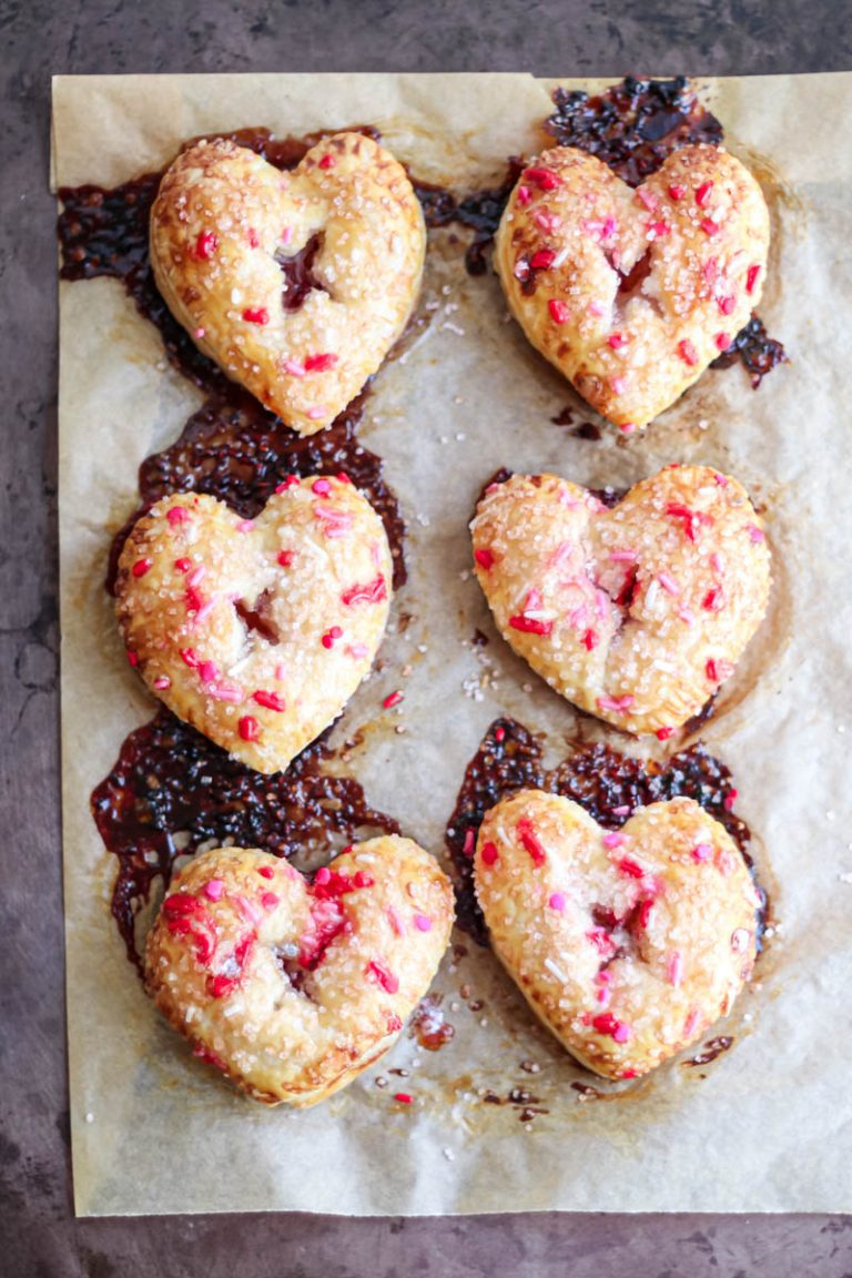 Heart Shaped Raspberry Hand Pies For Valentines Day - Modern Glam