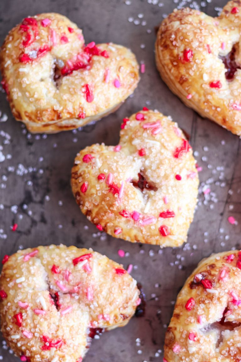 Heart Shaped Raspberry Hand Pies For Valentines Day - Modern Glam