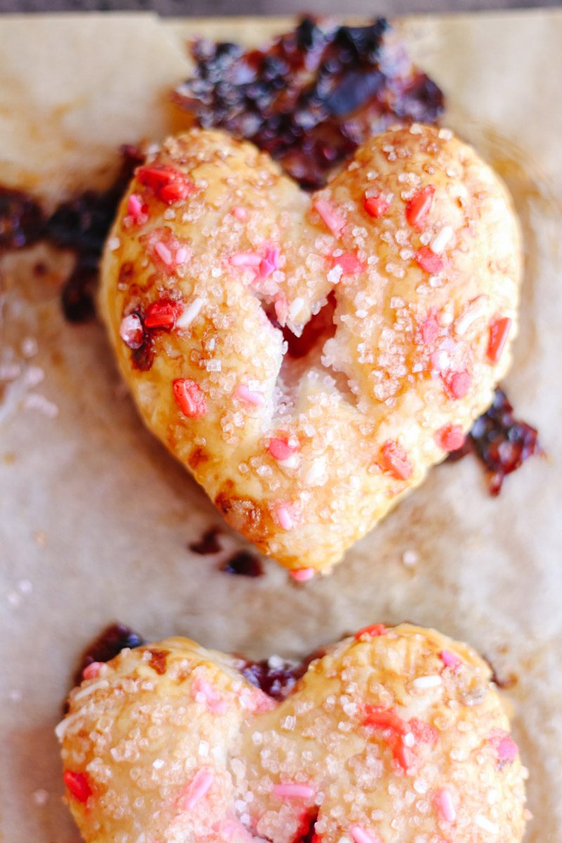 Heart Shaped Raspberry Hand Pies For Valentines Day - Modern Glam