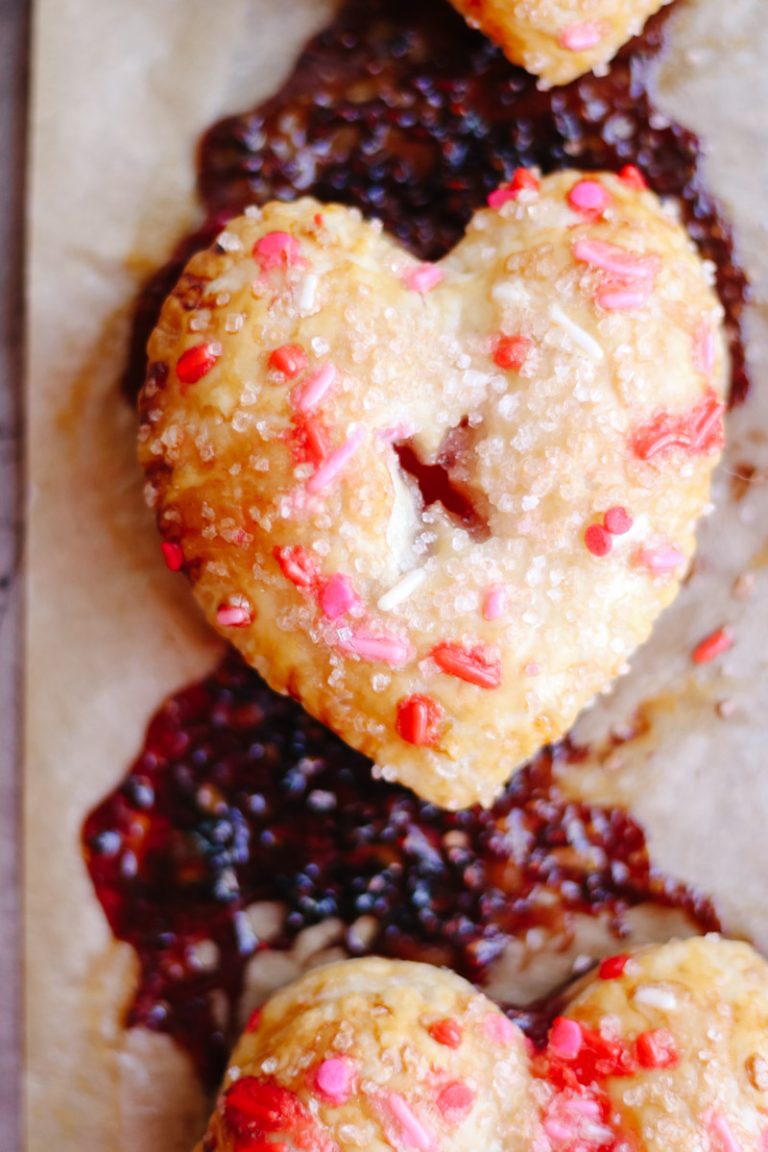 Heart Shaped Raspberry Hand Pies For Valentines Day - Modern Glam